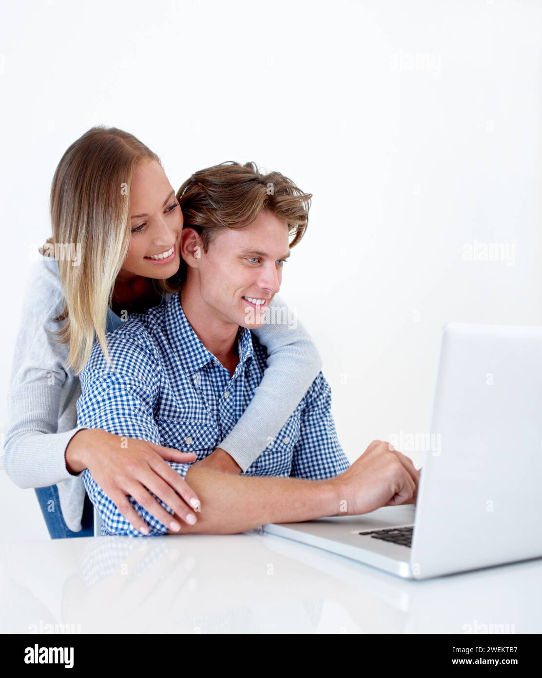 Couple, laptop and hug with email, online information and social ...