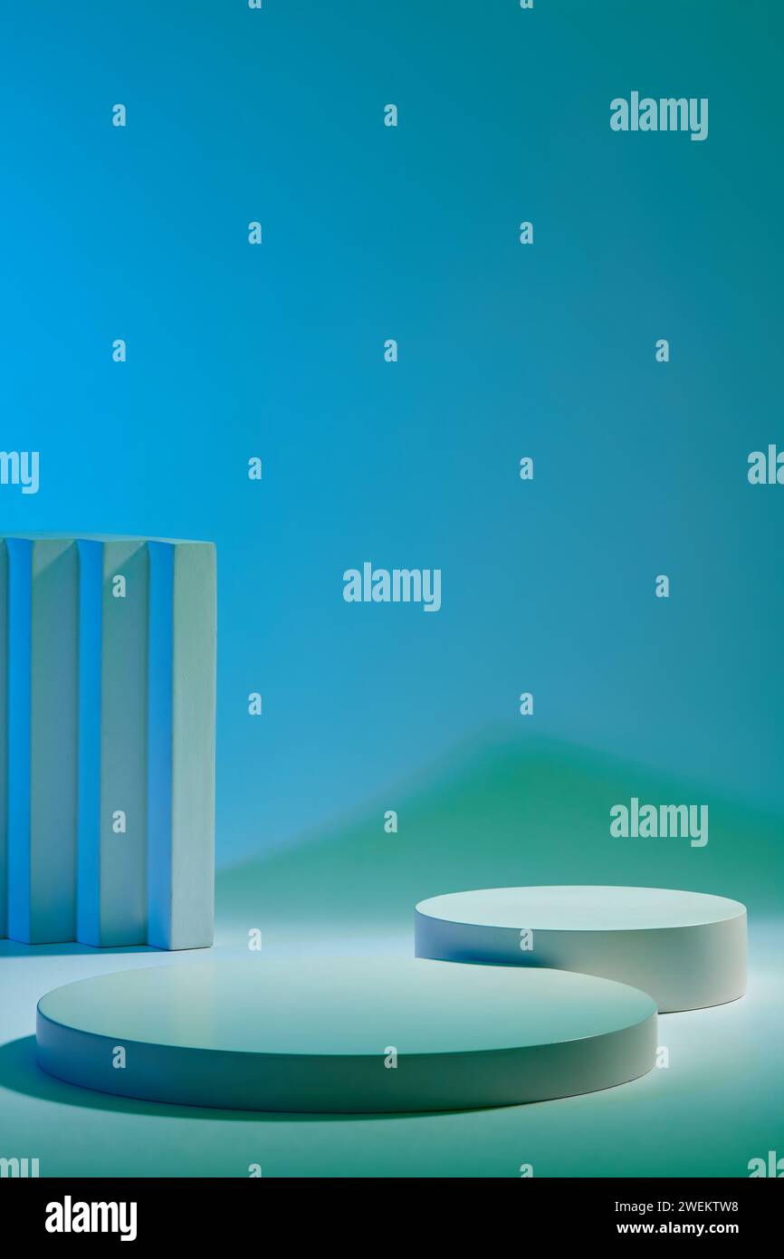 Front view of empty round podiums displayed on gradient blue background ...
