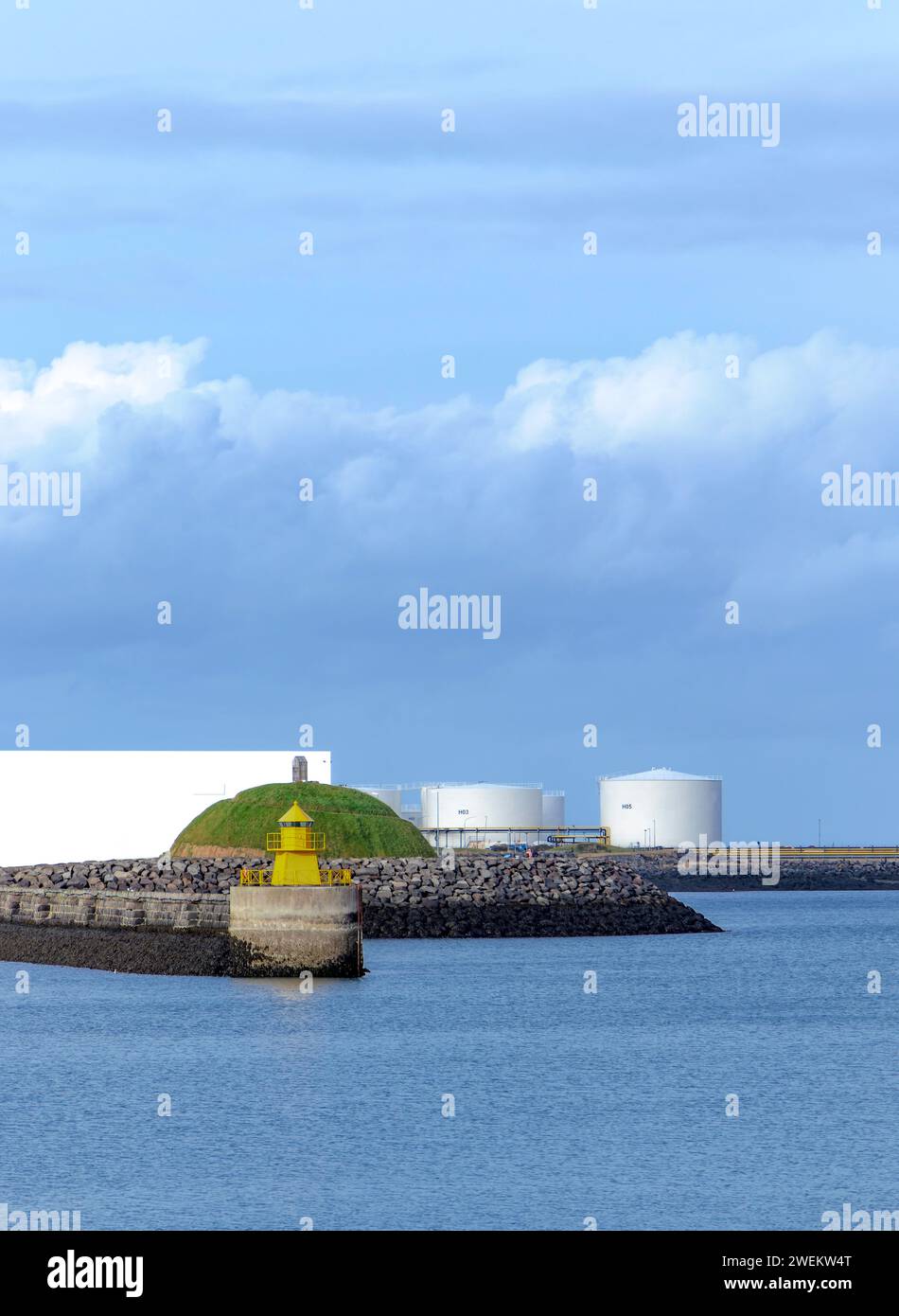 North Mole Head yellow lighthouse and green park in the port of ...