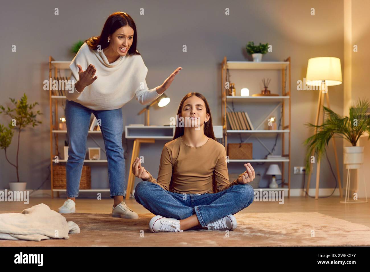 Calm Girl Meditating Relieving Stress And Ignoring Her Angry Mother