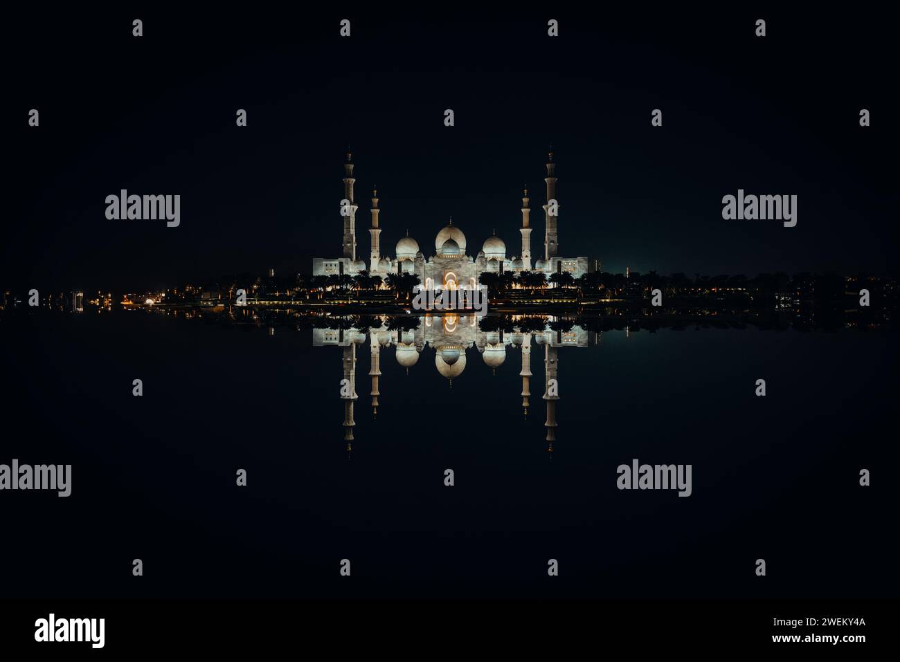 A nighttime view of the illuminated Sheikh Zayed Grand Mosque in Abu ...