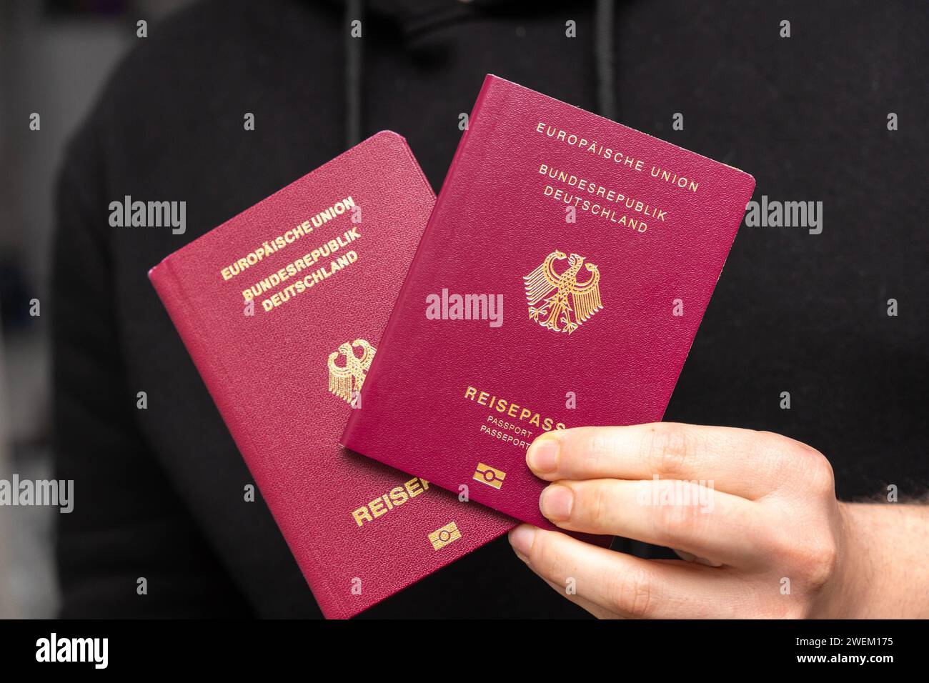 Bavaria, Germany - January 19, 2024: Man holding passports of the ...