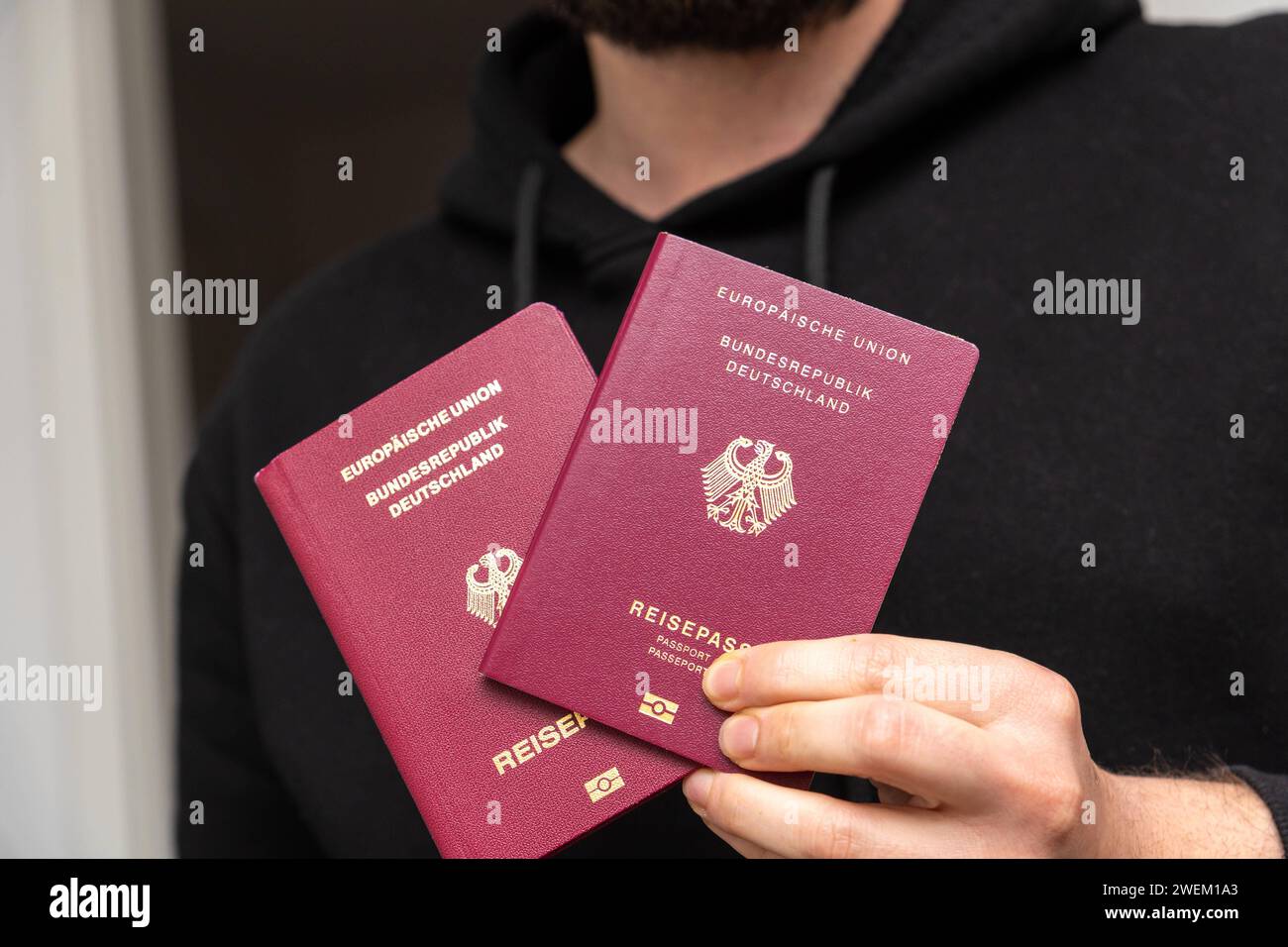 Bavaria, Germany - January 19, 2024: Man holding passports of the ...