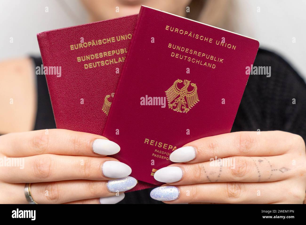 Bavaria, Germany - January 19, 2024: Woman holding passports of the ...
