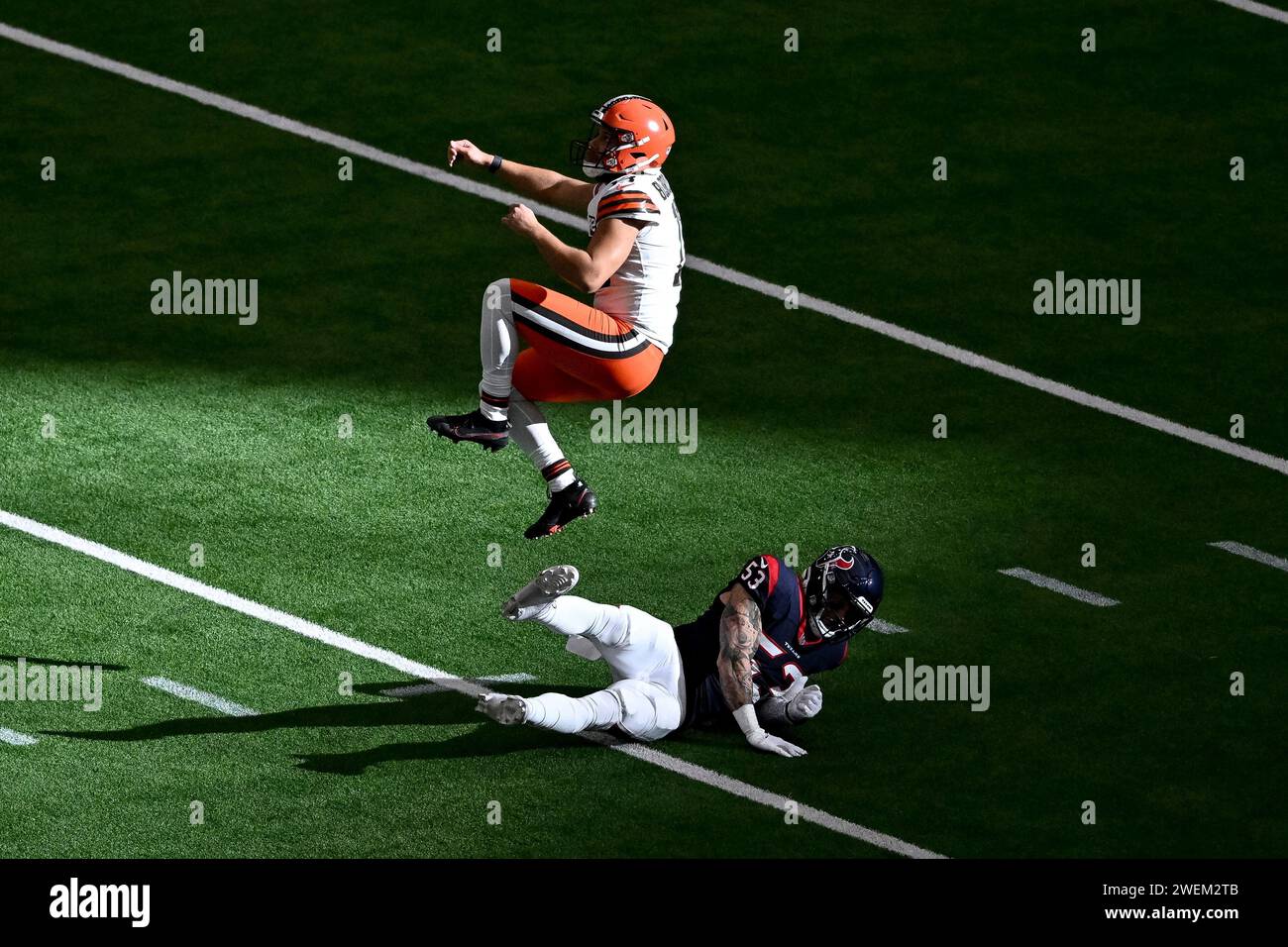 Cleveland Browns punter Corey Bojorquez (13) kicks the ball as Houston ...