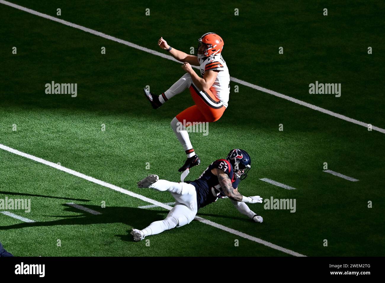 Cleveland Browns punter Corey Bojorquez (13) kicks the ball as Houston ...