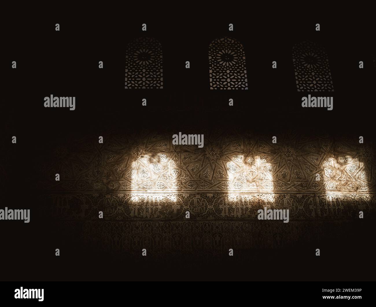 Sunlight coming through an engraved window of a famous Arabian palace ...