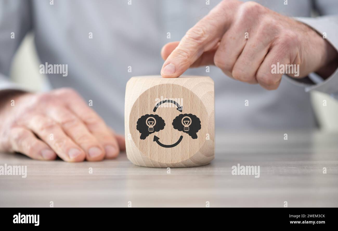 Wooden block with symbol of knowledge sharing concept Stock Photo - Alamy