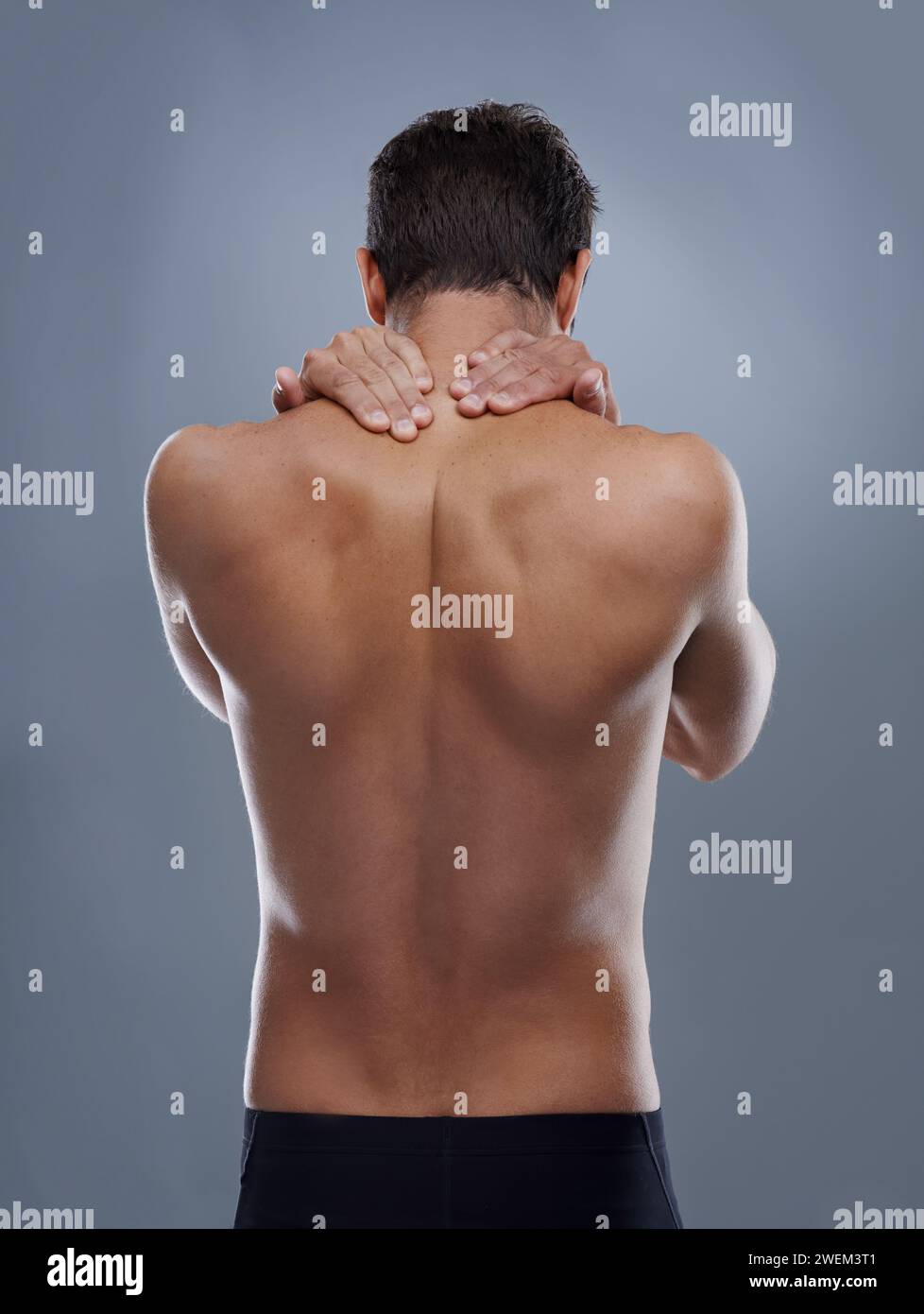 Man, neck pain and spine problem in studio, medical crisis and muscle ...