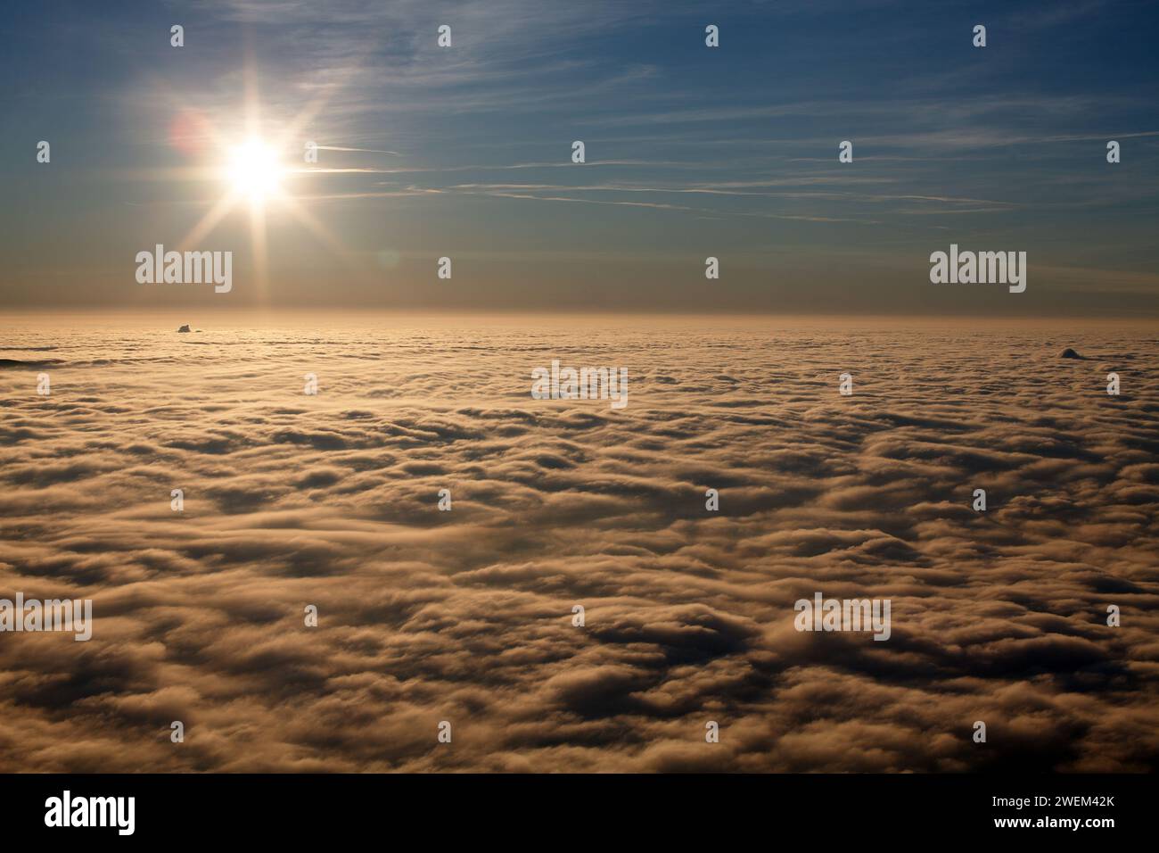 Sun over Clouds in a Heaven like Scene from a top of a Mountain Stock ...