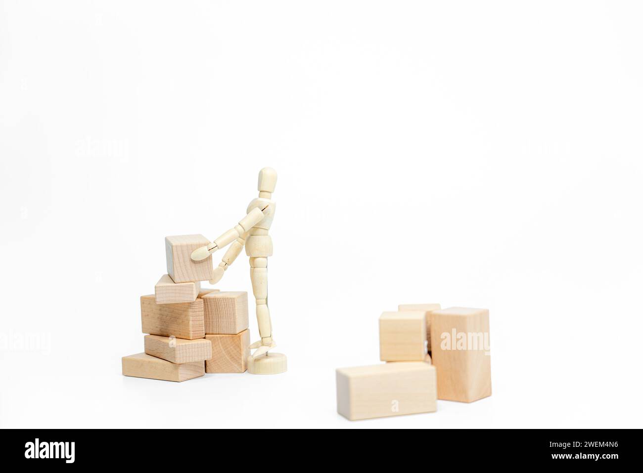 Wooden doll with wooden toy block isolated on white background ...