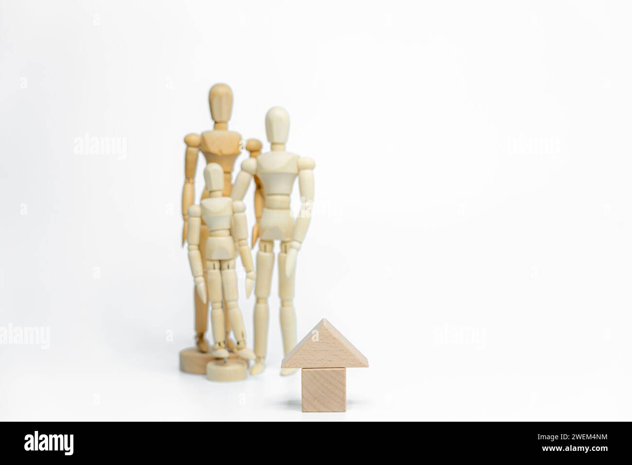 Wooden doll with wooden toy block isolated on white background ...