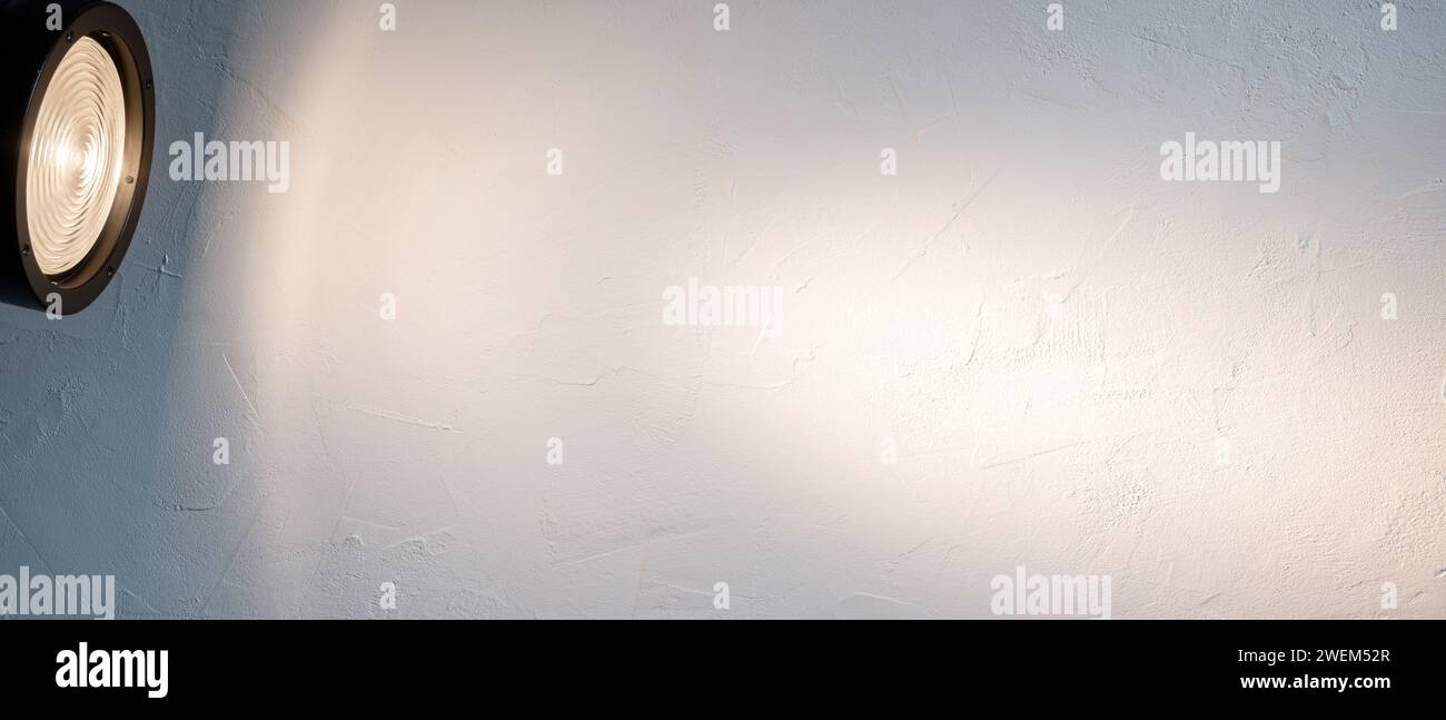 Fresnel Lens Round Light Fixture Illuminating a White Wall in a Dimly ...