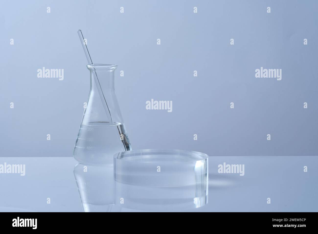 Lab theme, laboratory glassware - erlenmeyer flask containing colorless ...