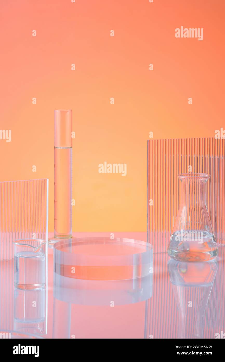 Front view of transparent podium with laboratory glassware filled ...
