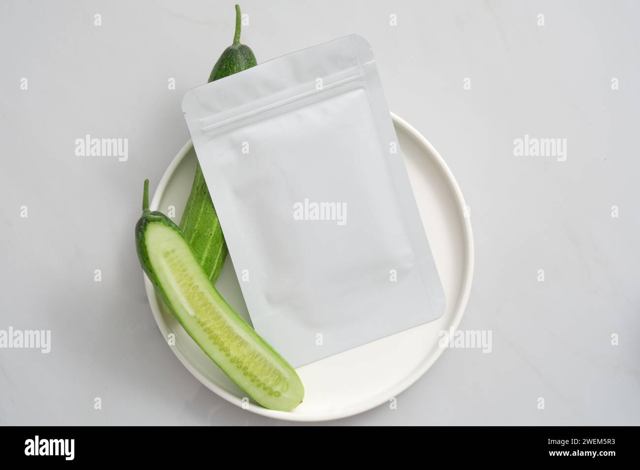 Facial sheet cucumber mask package mockup, fresh cucumber slices on ...