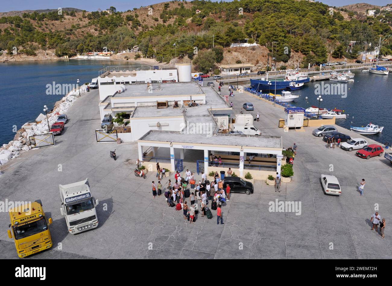 people waiting for the ferry boat in Lakki harbour, Leros island ...