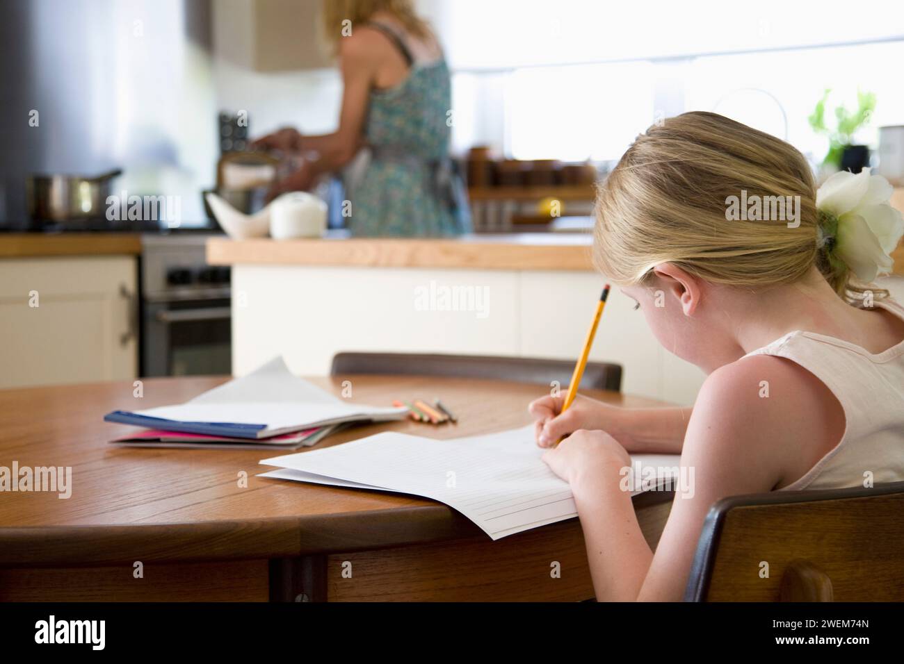 Mum two kids working kitchen table hi-res stock photography and images ...