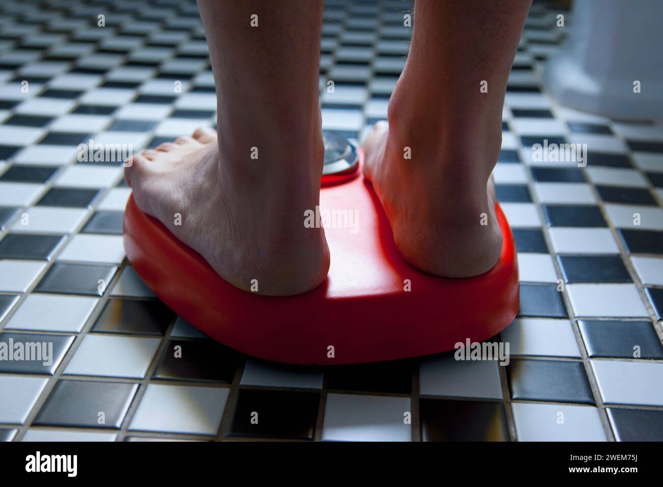 Close up of Feet on Weighing Scale Stock Photo - Alamy