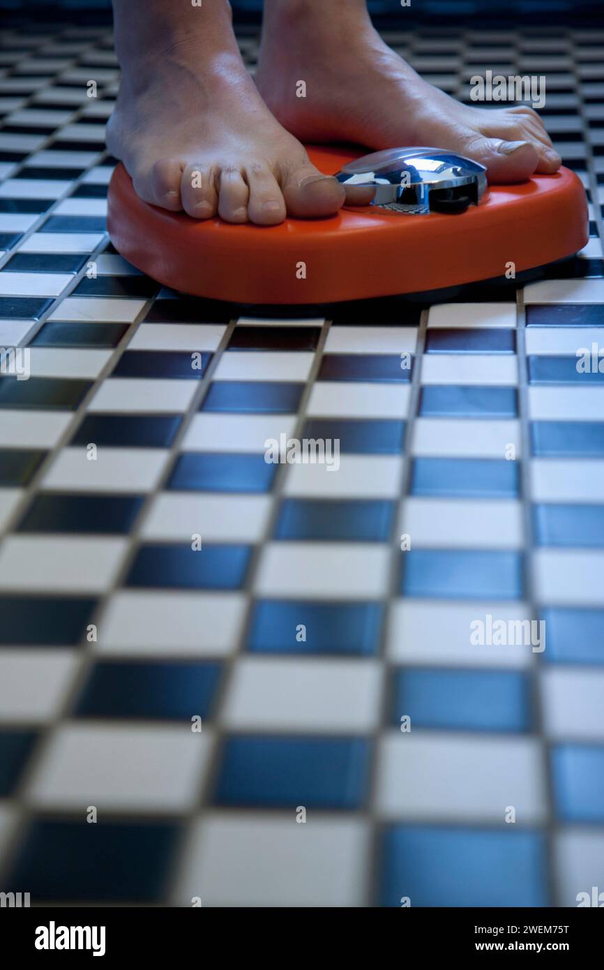 Close up of Feet on Weighing Scale Stock Photo - Alamy