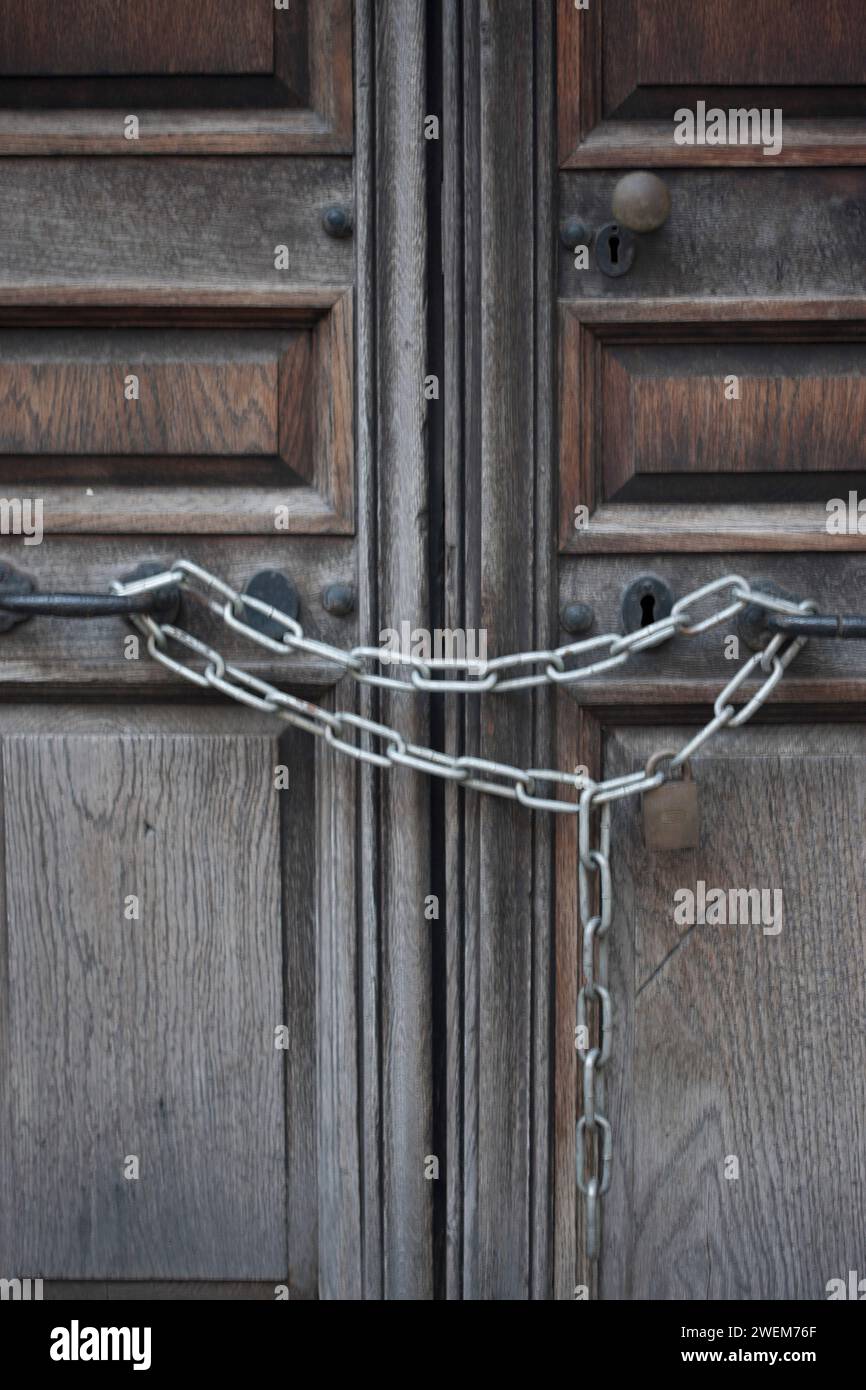 Wood Door Locked with Chain Stock Photo - Alamy