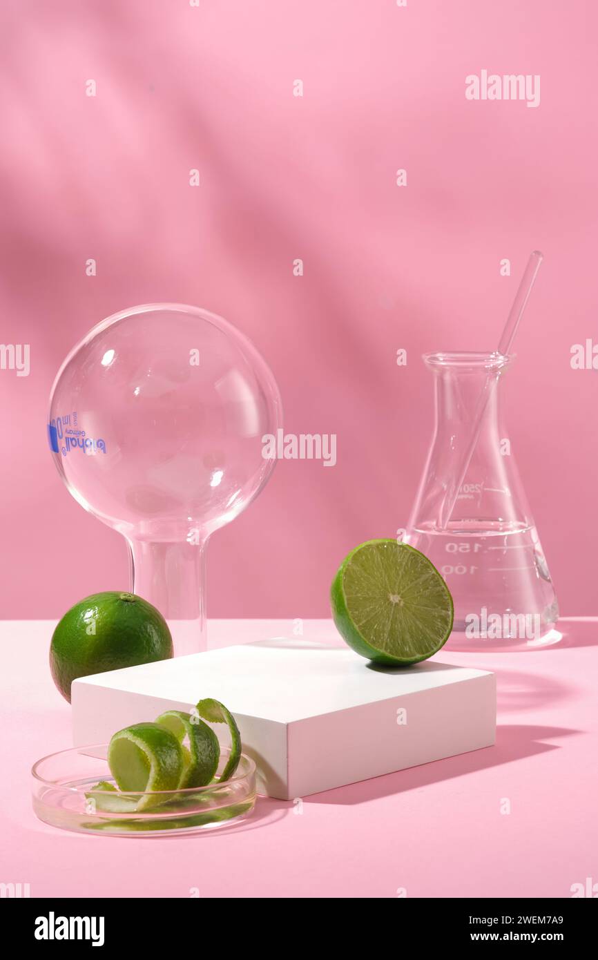 Scene for advertising product with laboratory concept - fresh limes and ...