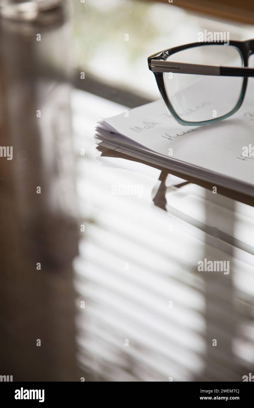 Eyeglasses and Paperwork on Desk Stock Photo - Alamy