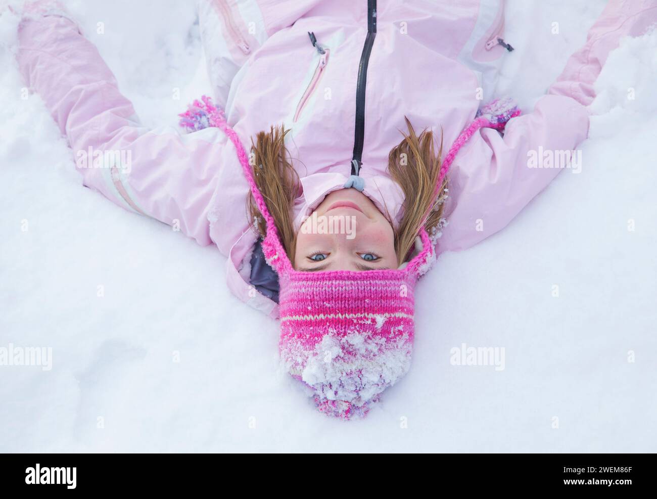 Girl Wearing Pink Woolly Hat in the Snow Stock Photo - Alamy