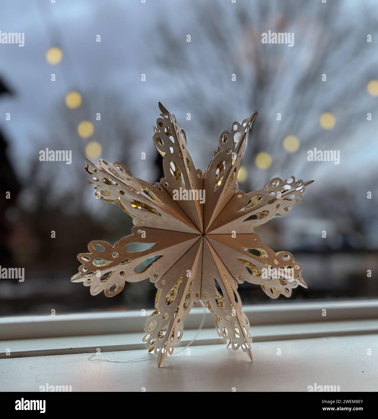 Paper star decor in front of a winter view Stock Photo - Alamy