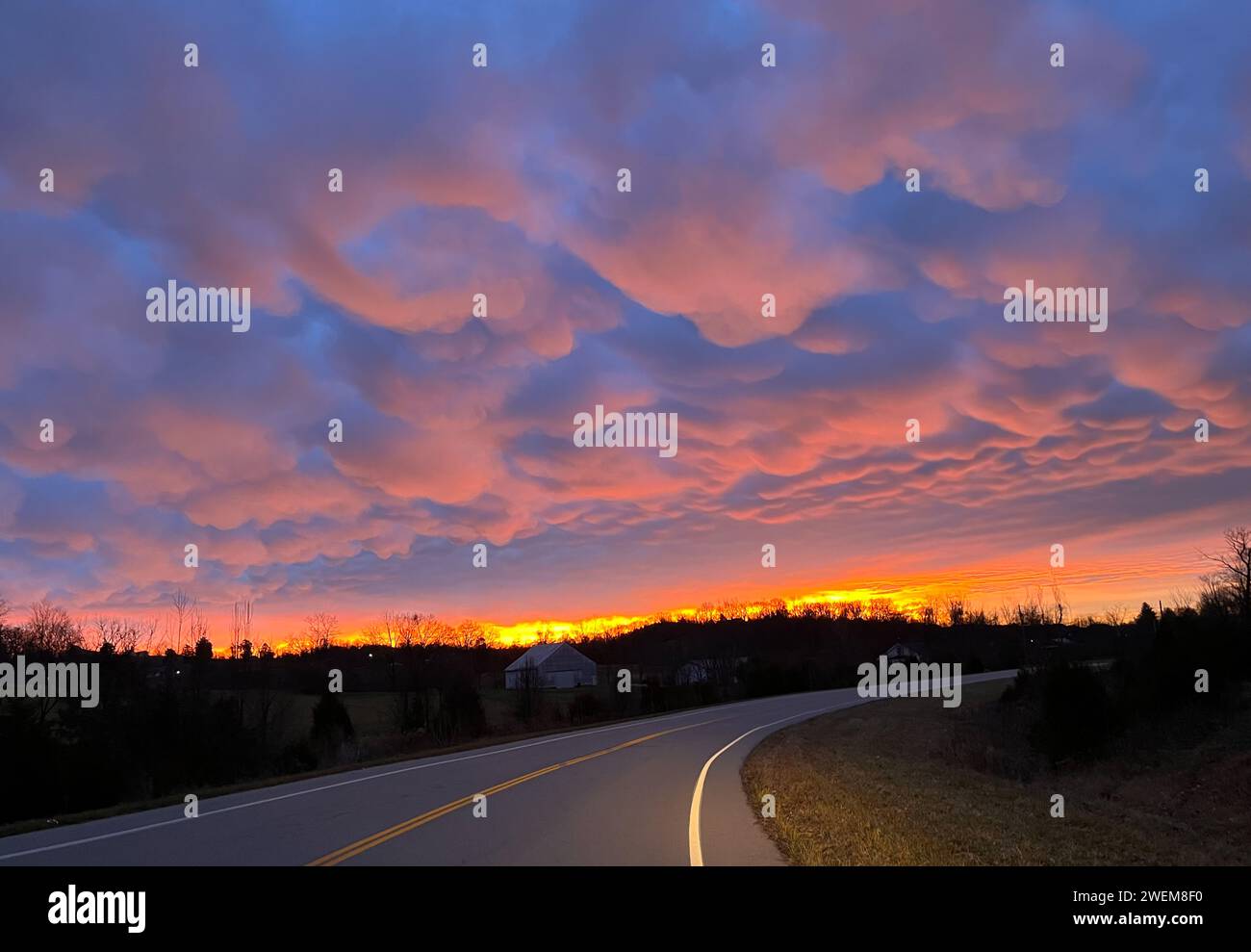 Morning drive with a golden sunrise Stock Photo - Alamy