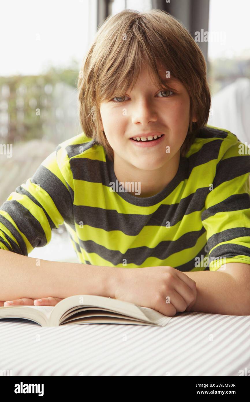 Boy Reading Book Stock Photo - Alamy