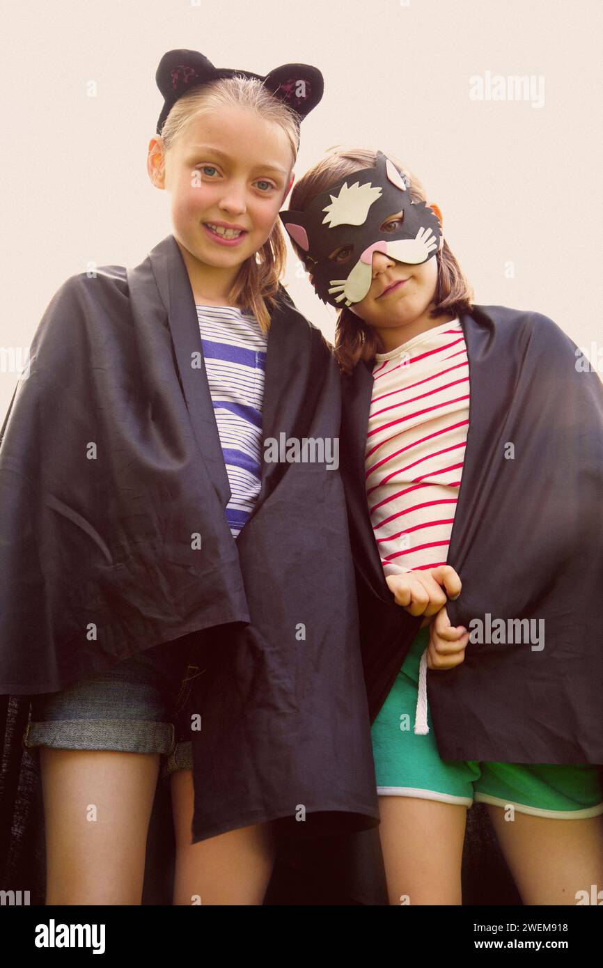 Young girls wearing cape mask hi-res stock photography and images - Alamy