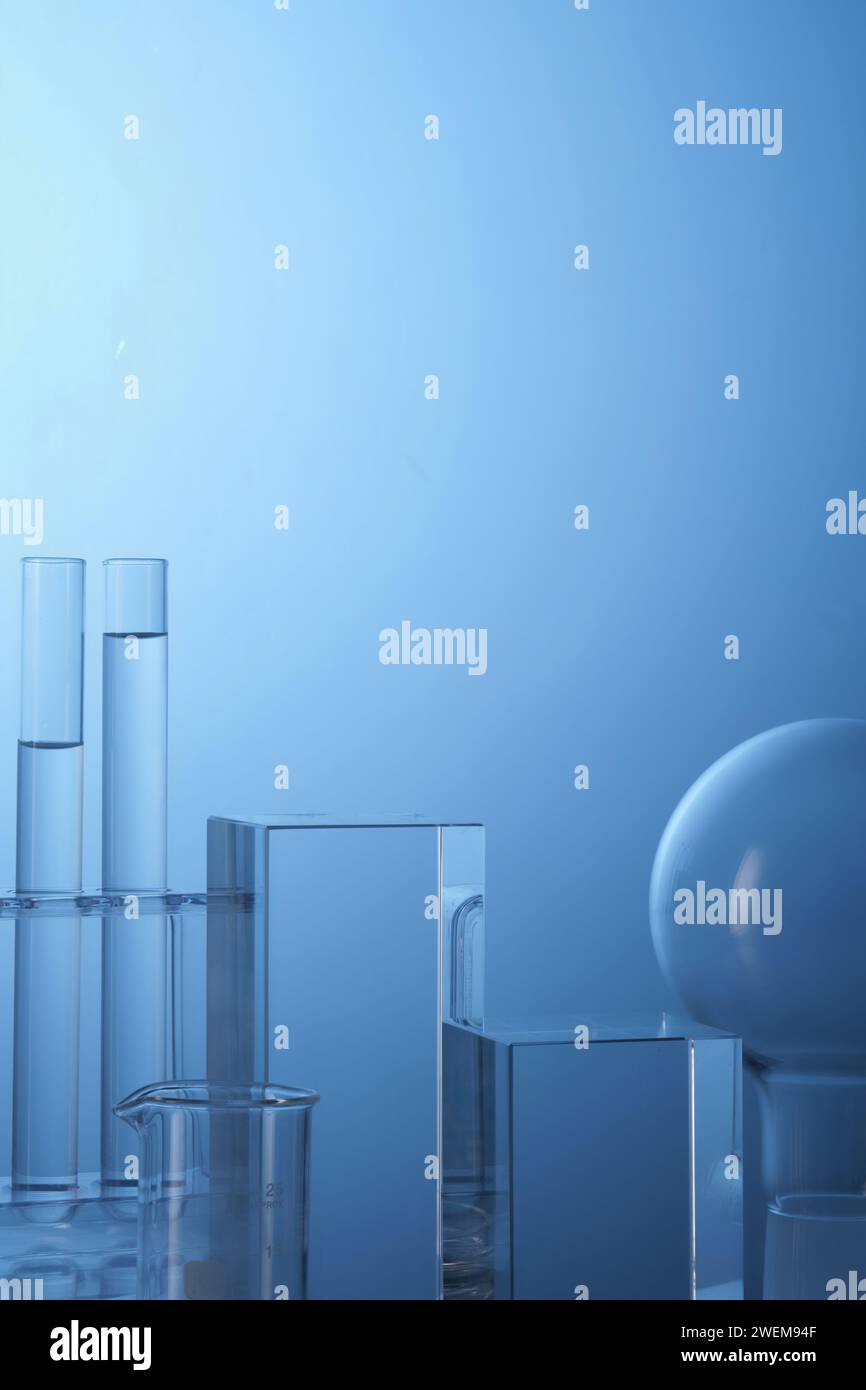 Transparent liquid contained inside laboratory glassware with empty ...