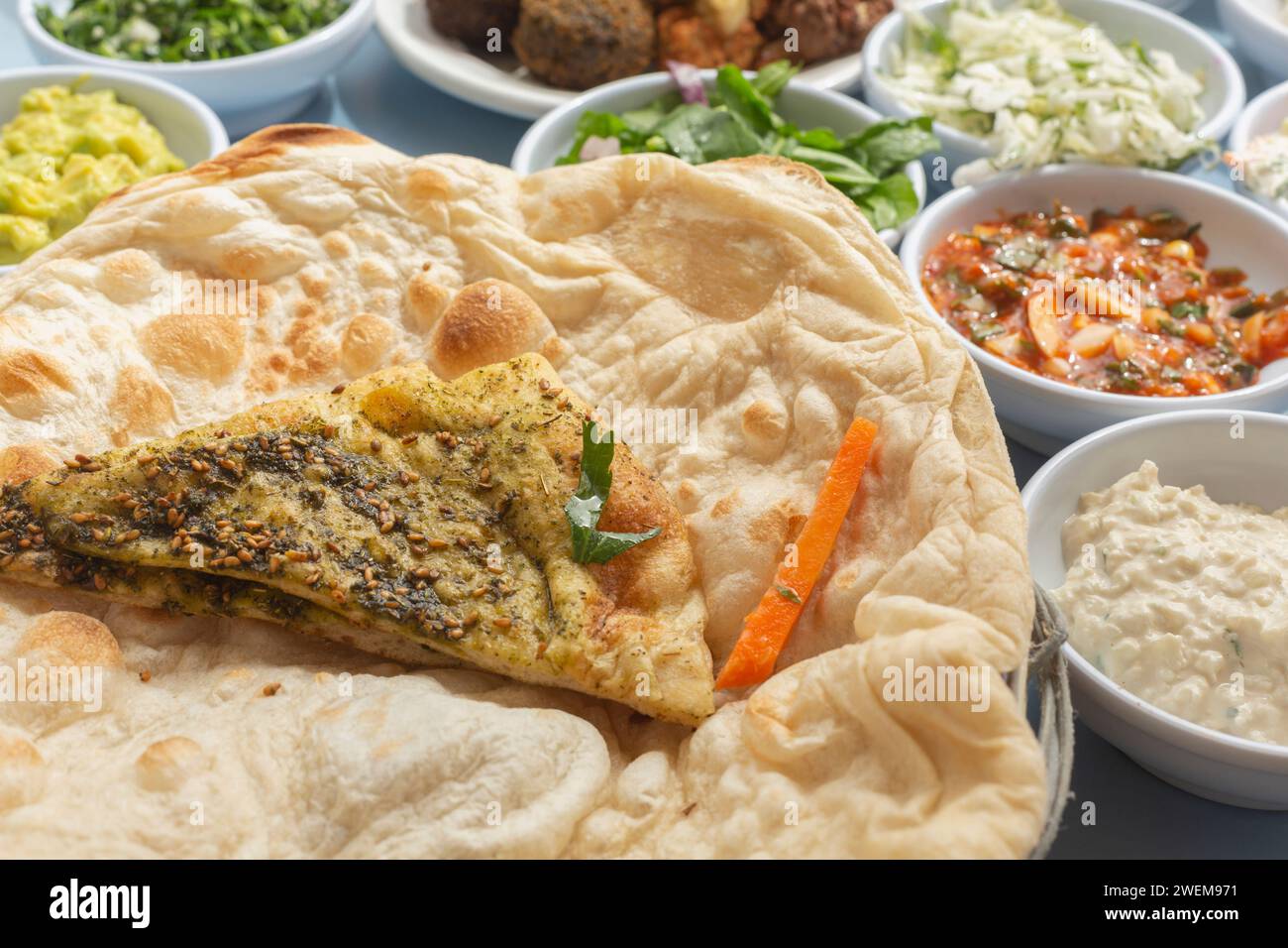 Still life flatbread with zaatar and Israeli meze appetizers Stock ...
