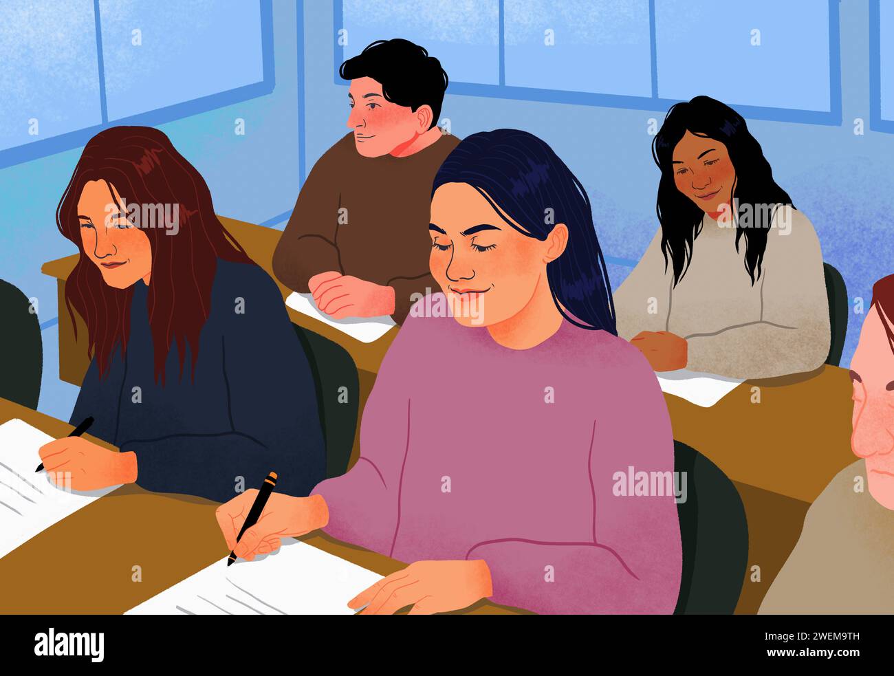 College students taking exam in classroom Stock Photo - Alamy