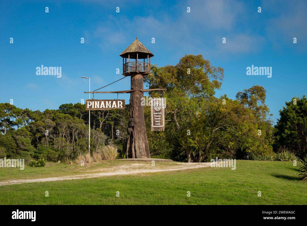 Entrance to the city of Pinamar, pine forest and blue sky in Argentina ...