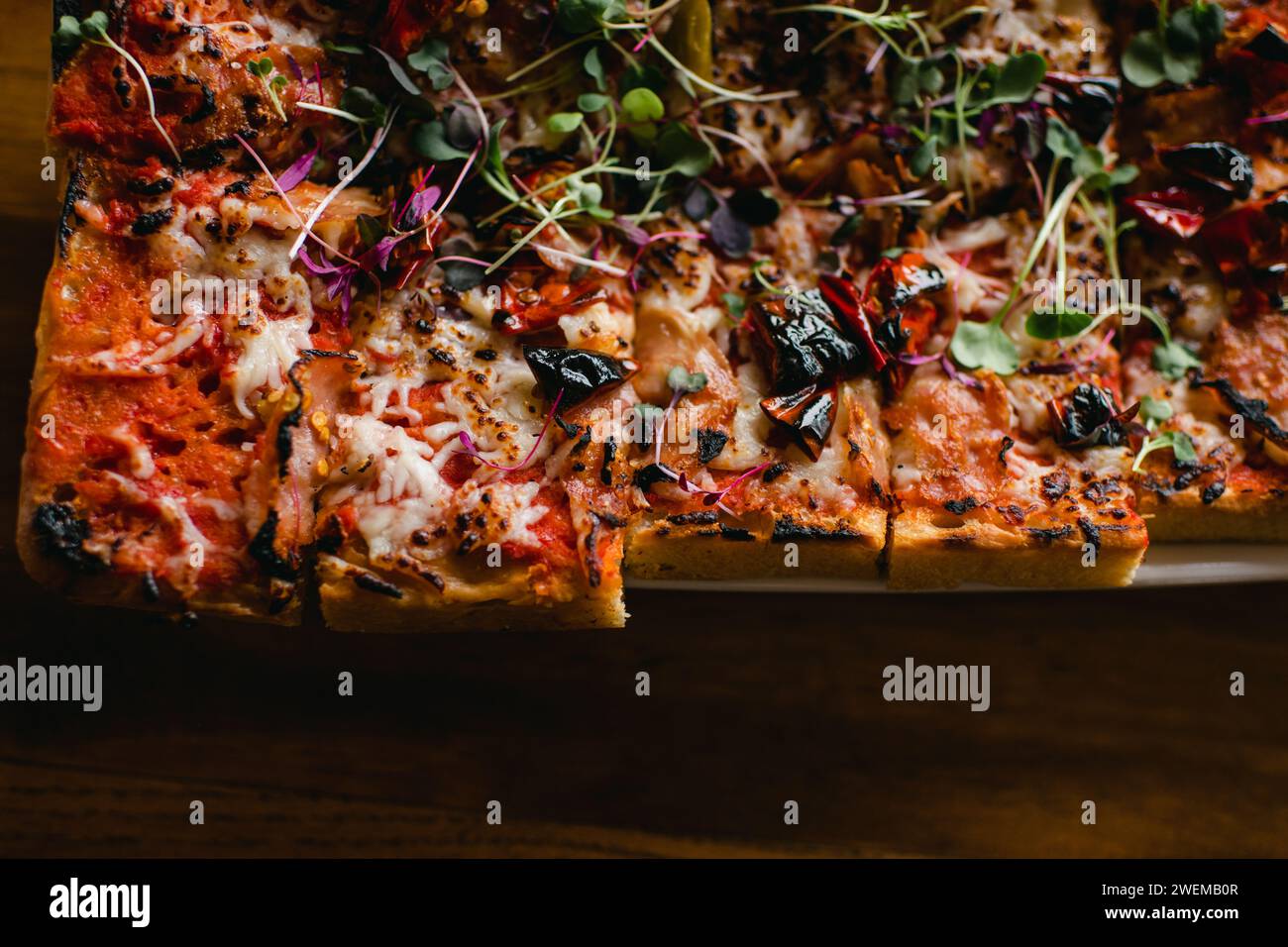 Top view of flatbread pizza with roasted peppers and sprouts Stock ...