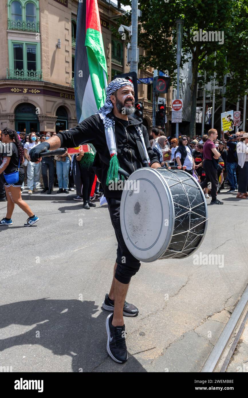 Melbourne, Australia. 26th Jan, 2024. A Palestinian activist plays a ...