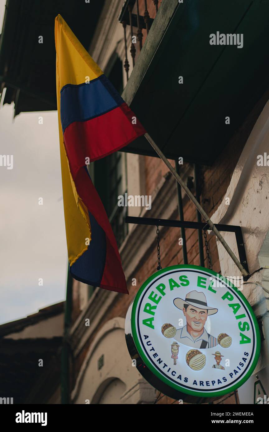 arepas sign next to a Colombian flag Stock Photo - Alamy
