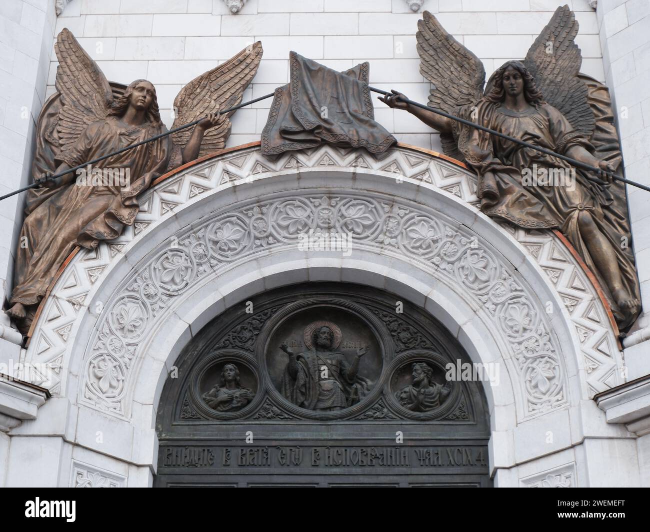 Decorations of bronze figures above the entrance of the temple Stock ...