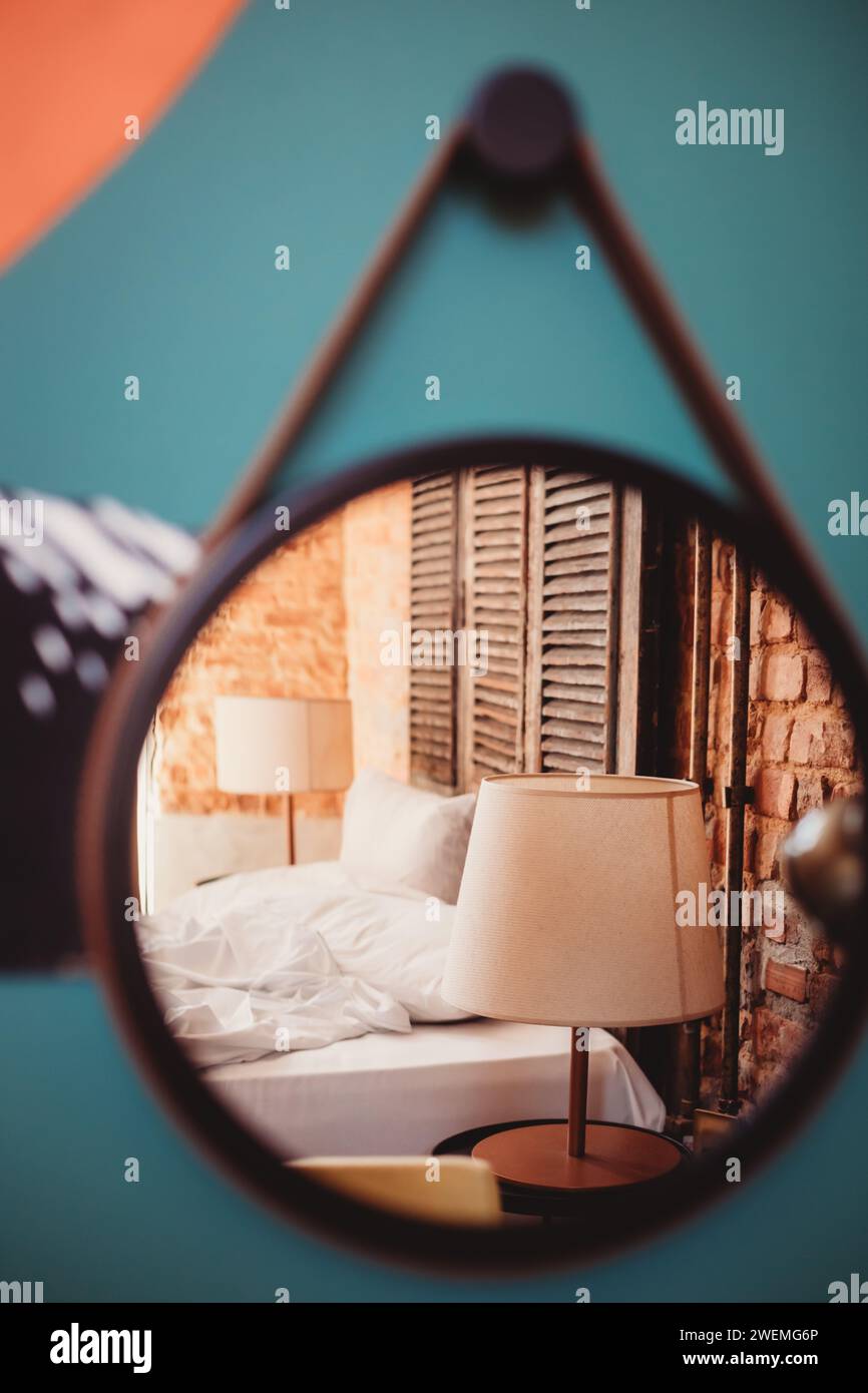 Reflection in mirror of a bedroom Stock Photo - Alamy