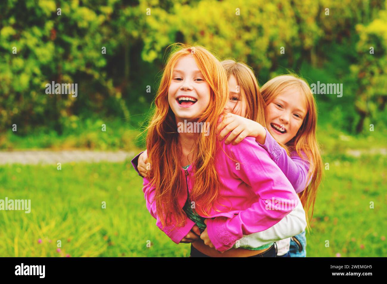 3 little girls having fun outdoors Stock Photo - Alamy
