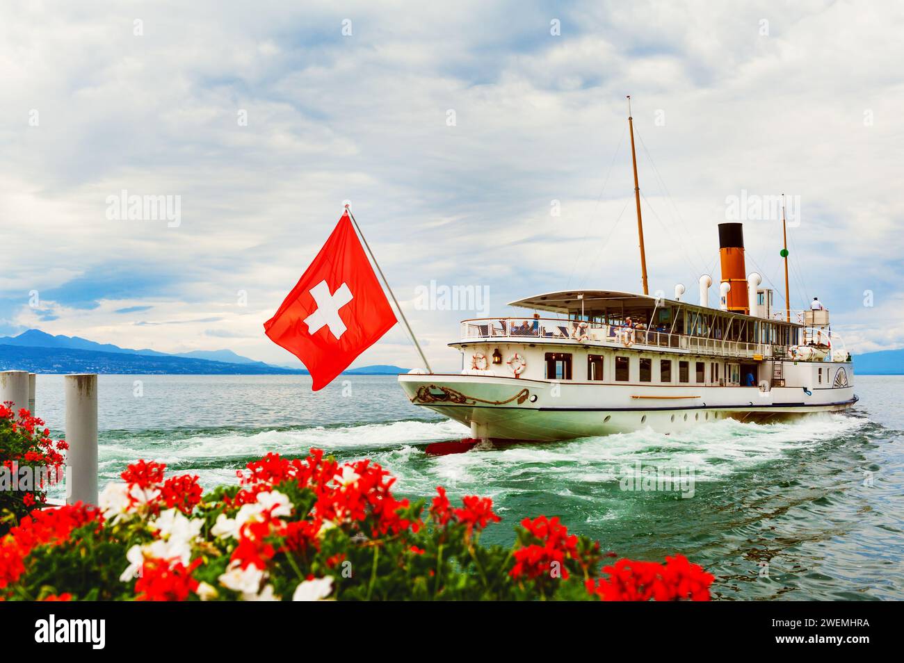 Steam boat with swiss flag floating on the lake Geneva Stock Photo - Alamy