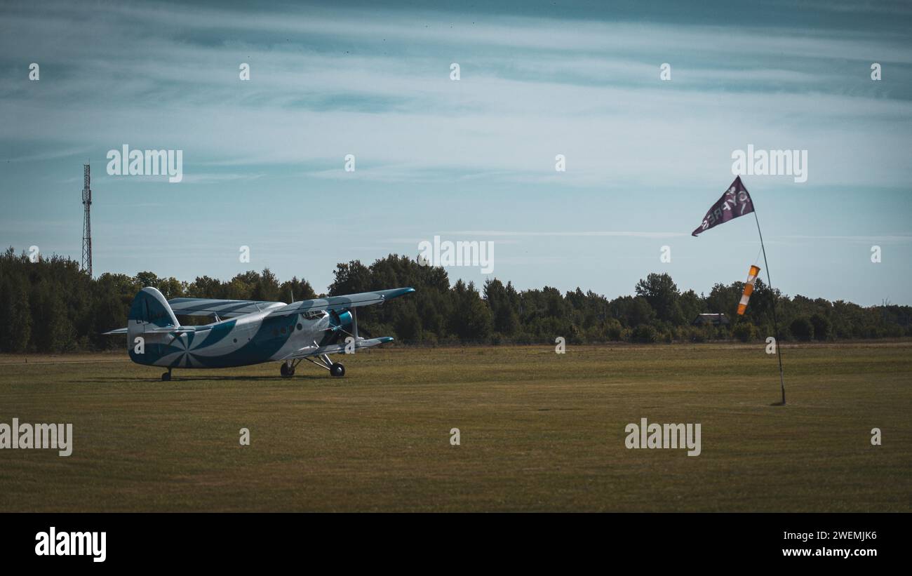 Old blue plane takeoff Stock Photo - Alamy
