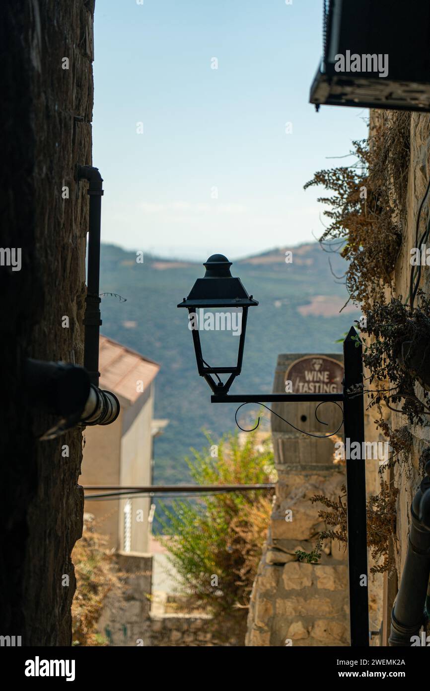 Town empty lamp post over hills Stock Photo - Alamy