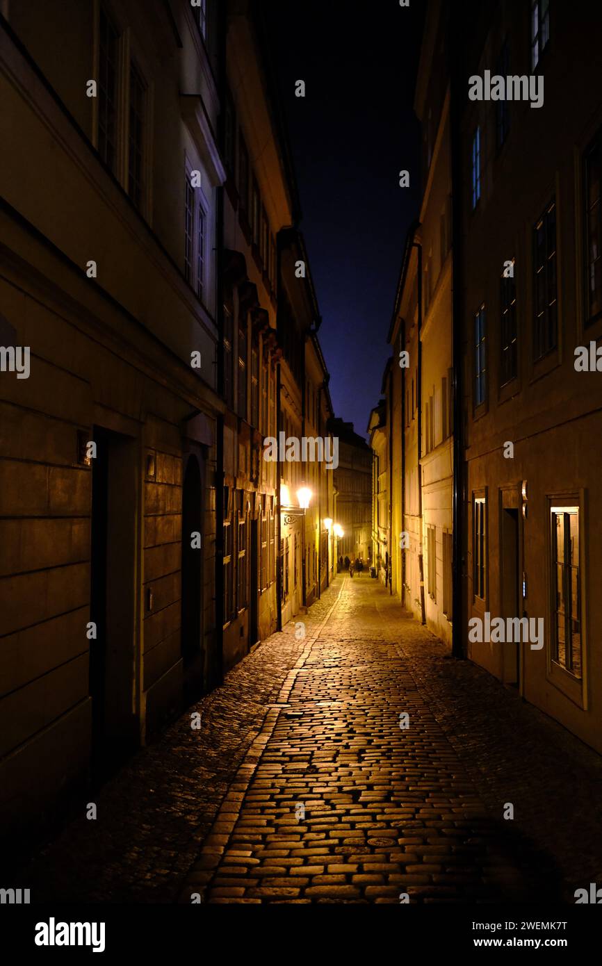 Nighttime street scene in Prague with streetlights and cobbles Stock ...
