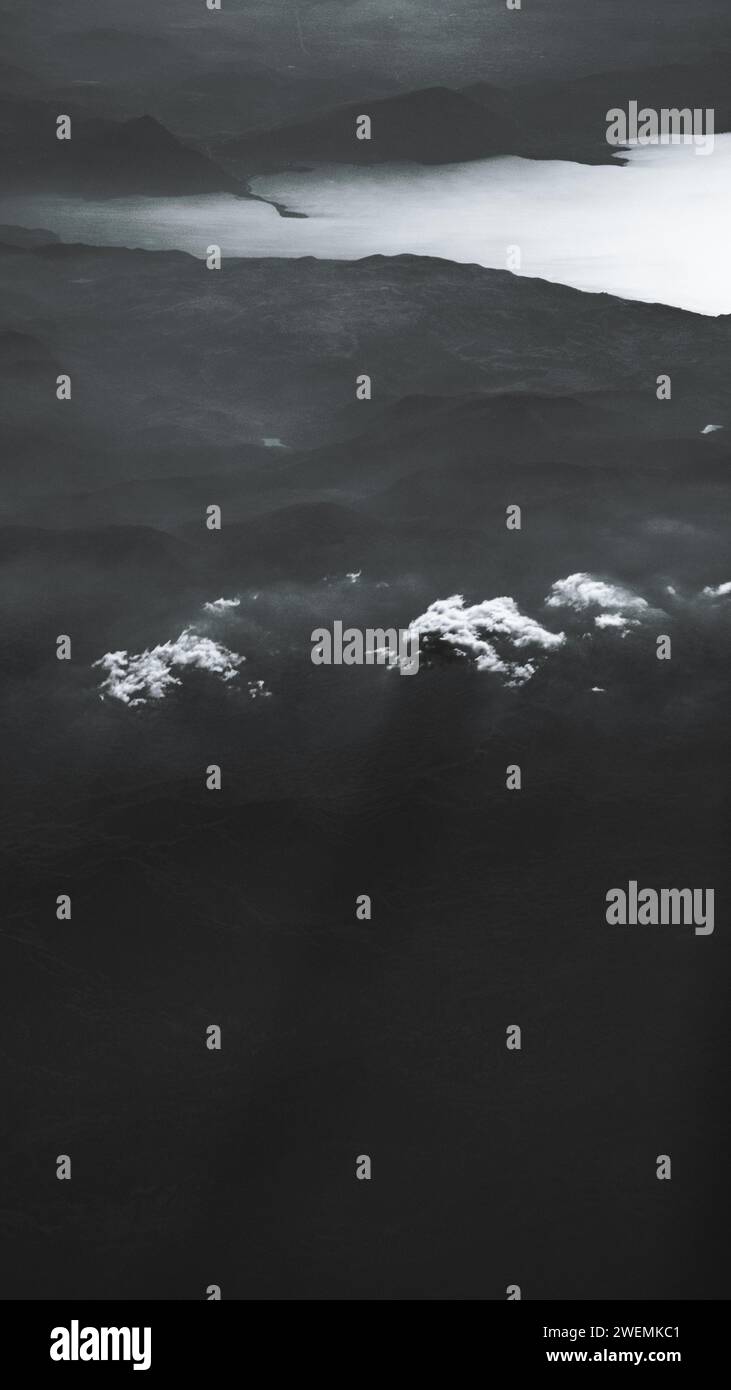 Top view of maintains and lonely cloud Stock Photo - Alamy