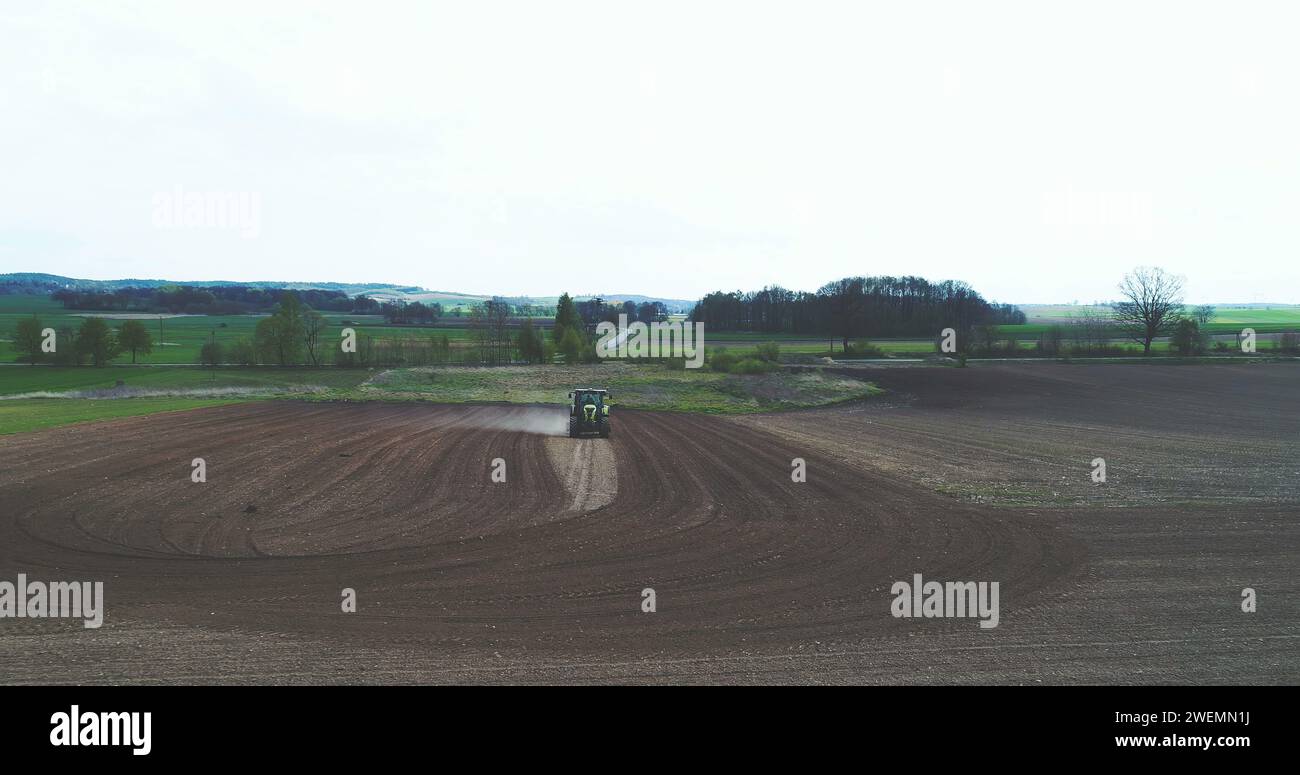Farmer plowing field. Agriculture background Stock Photo - Alamy