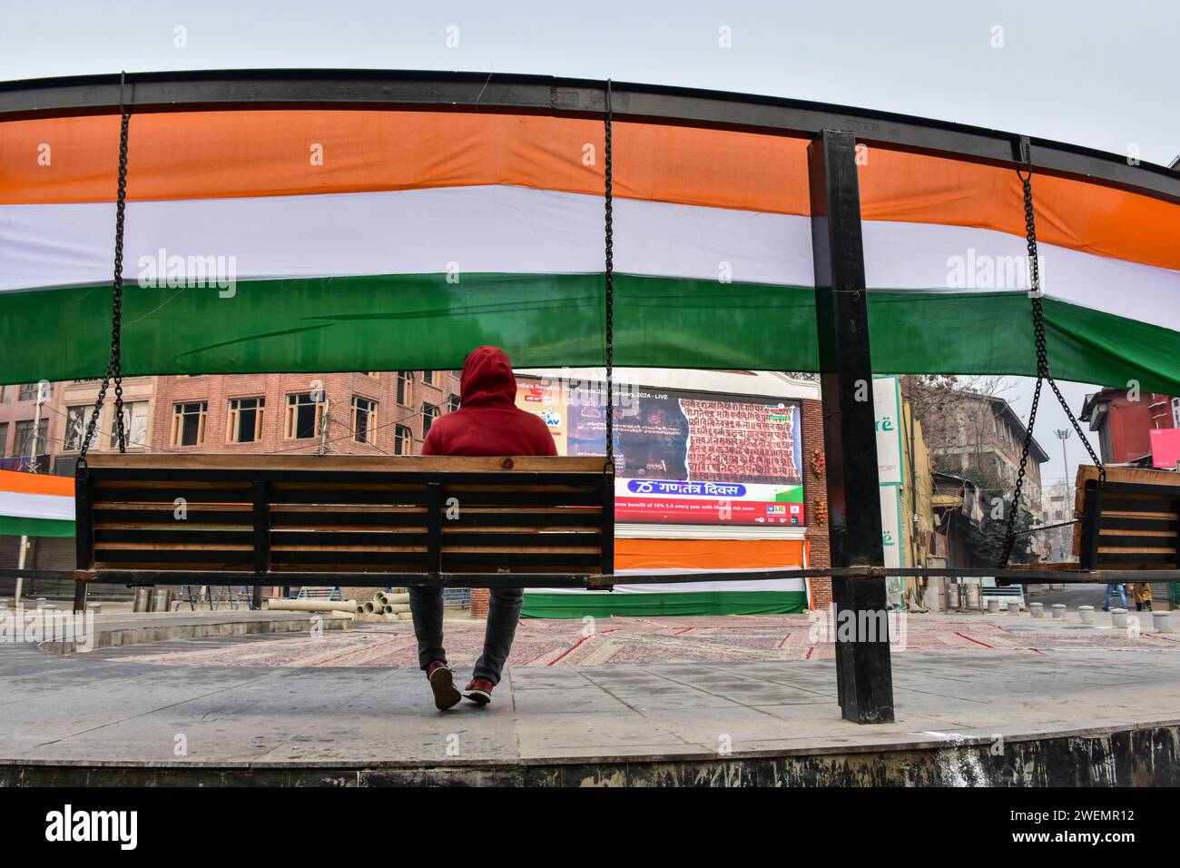 A non-local watches a live telecast of India's Republic Day ...