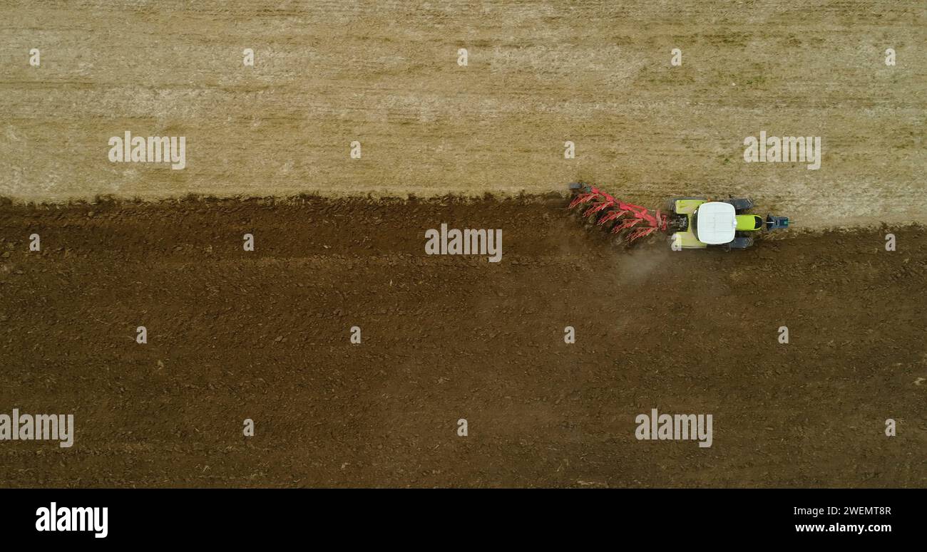 AGRICULTURE - Wide shoot of tractor plowing field 4K Stock Photo - Alamy